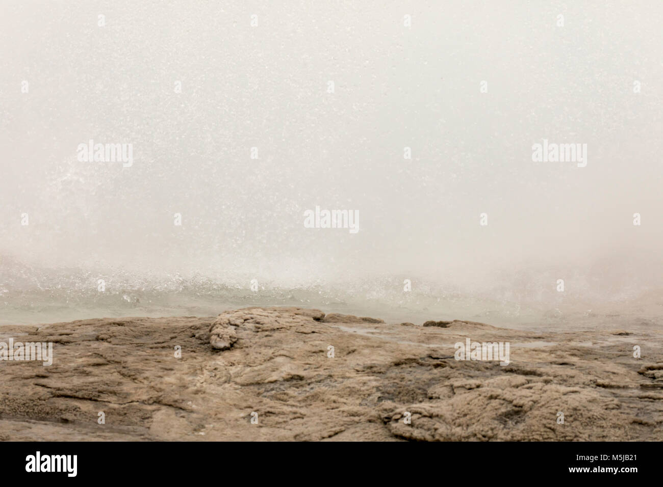 Steam and water erupting from geyser vent at Fountain Paint Pots in ...