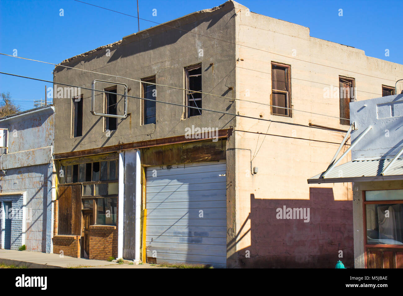 Abandoned Two Story Building With Boarded Up Windows Stock Photo - Alamy