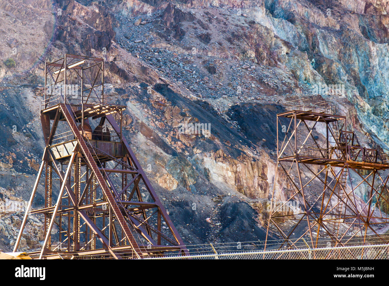 Two Old Iron Towers At Base Of Mining Operation Stock Photo - Alamy
