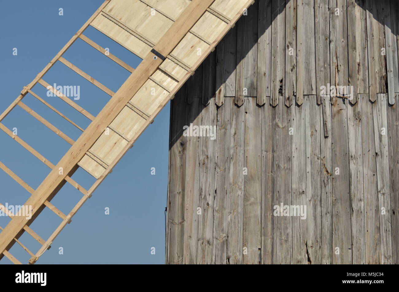 Wooden windmill. Monument. Antique mill powered by the wind Stock Photo ...