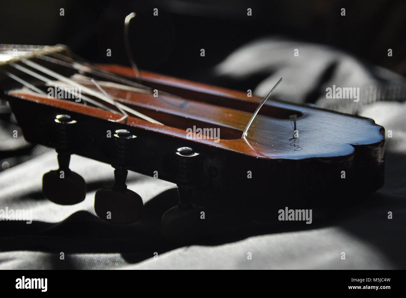 Classical guitar. Issuing a stringed instrument sounds. Fretboard ...