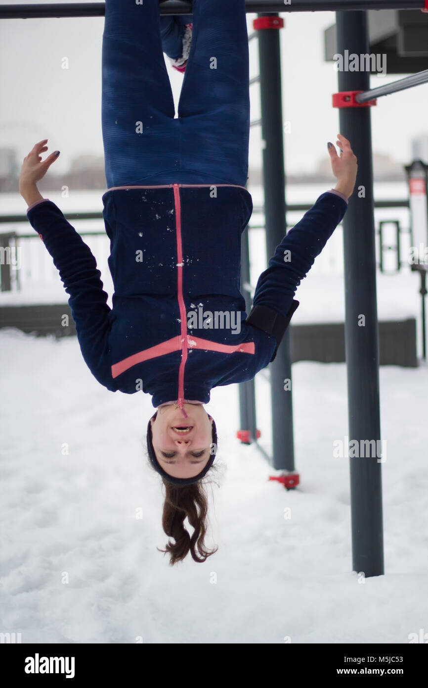 Fitness female hanging upside down hi-res stock photography and images ...