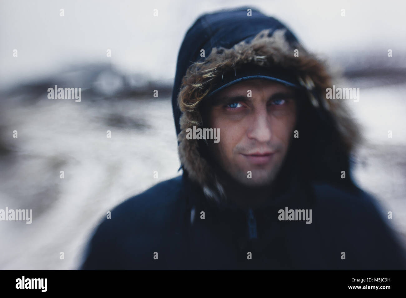 Male model posing in snow hi-res stock photography and images - Alamy