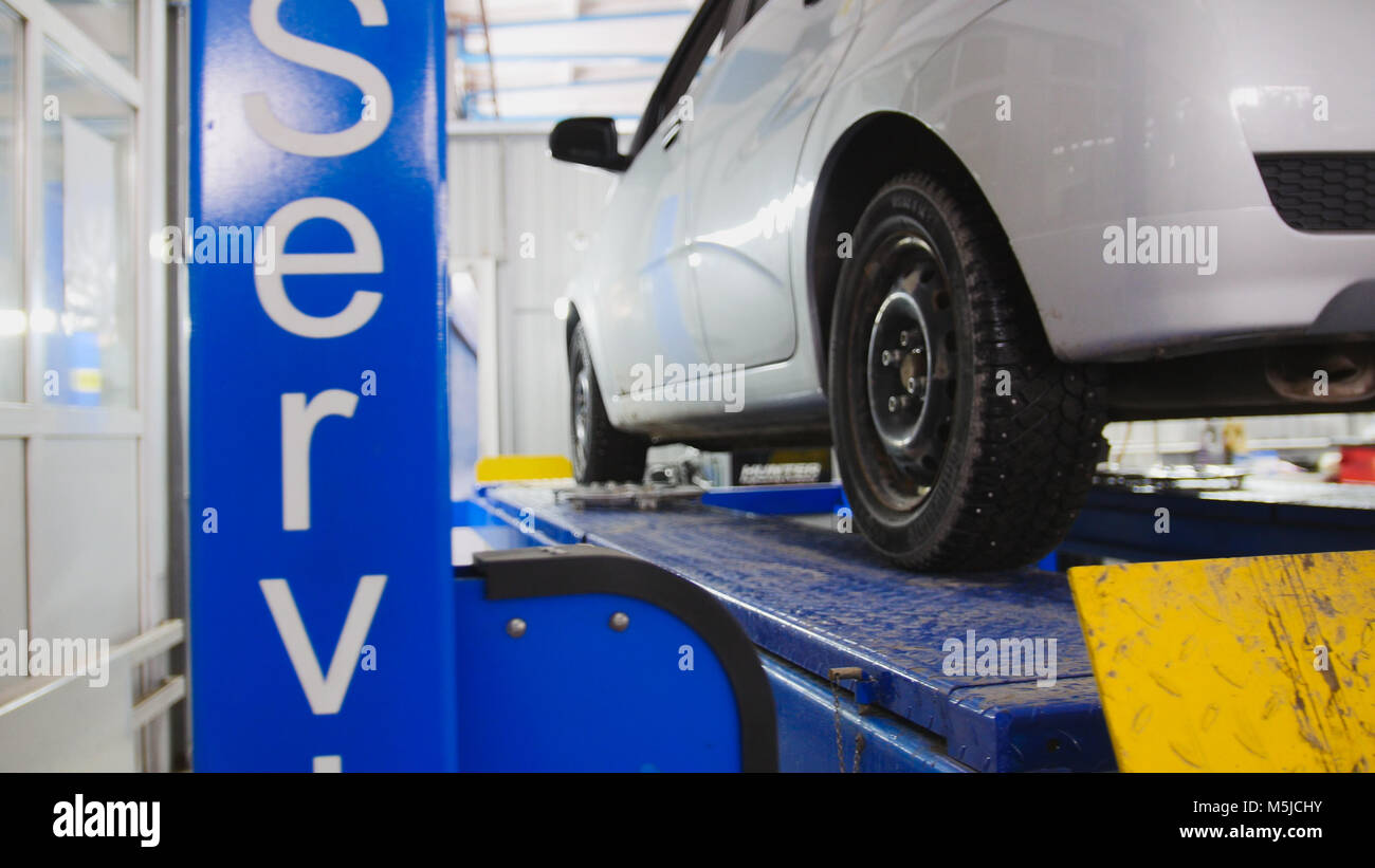 Auto wheel alignment in service, car preparing for professional ...