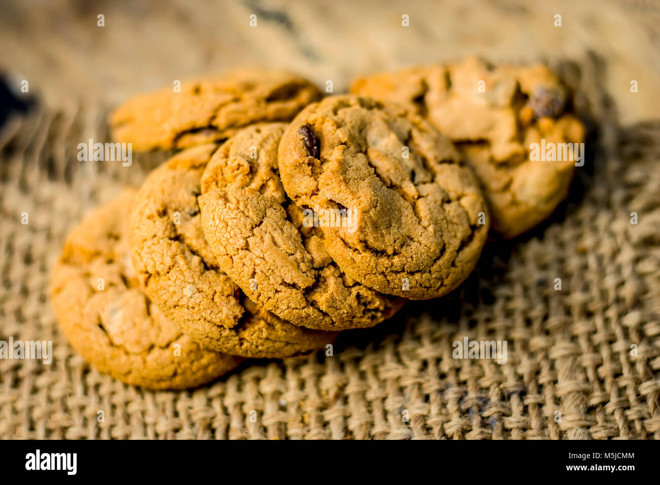 Homemade freshly baked chocolate chip cookies on gunny background Stock ...