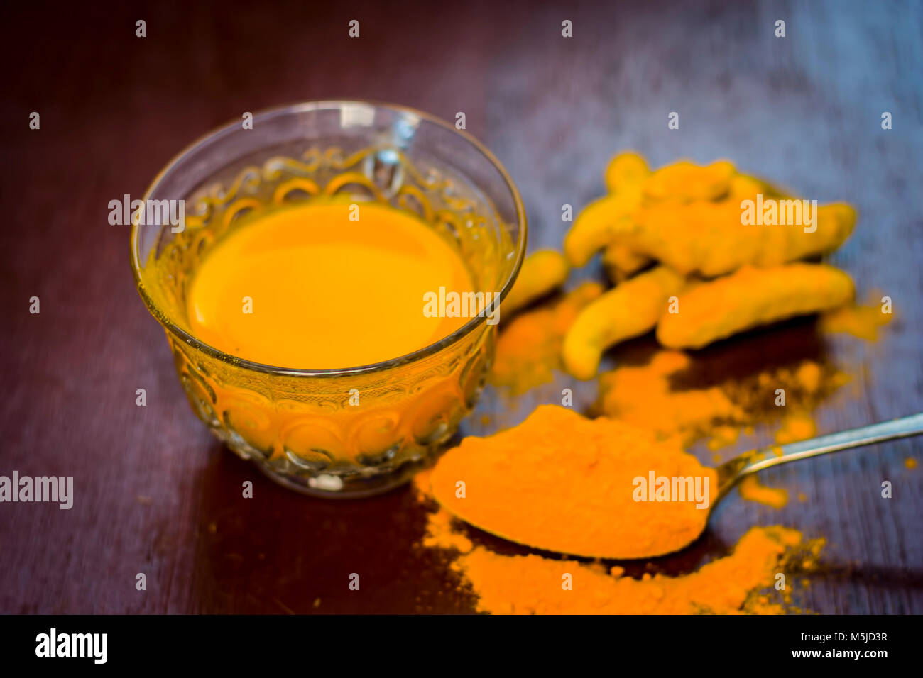 Tea of turmeric,Curcuma longa with its powder Stock Photo - Alamy