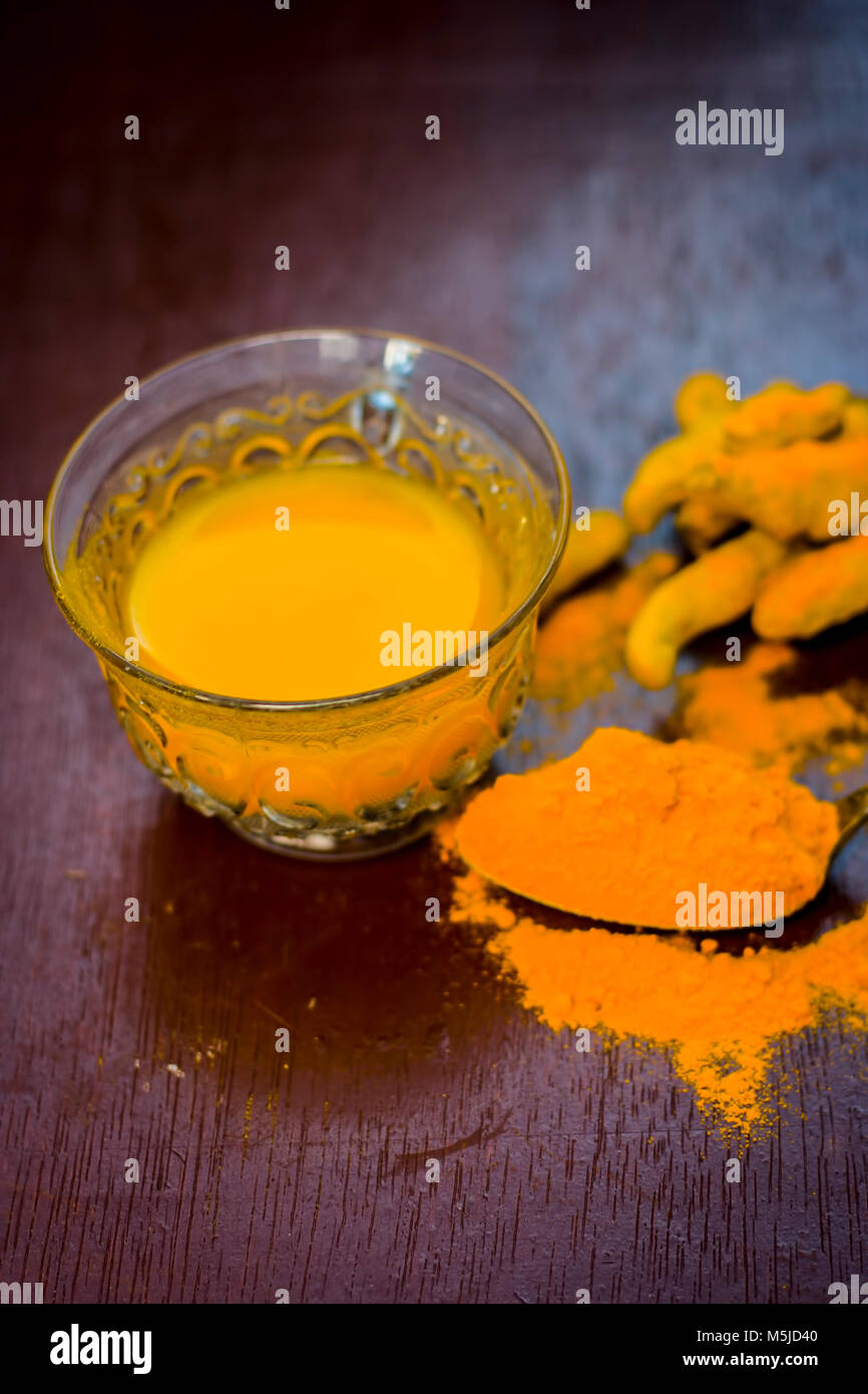 Tea of turmeric,Curcuma longa with its powder Stock Photo - Alamy