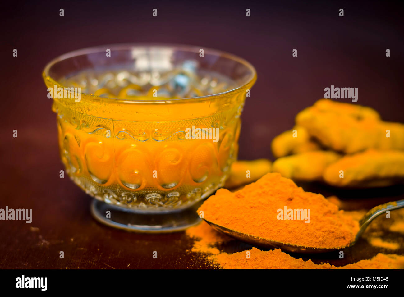 Tea of turmeric,Curcuma longa with its powder Stock Photo - Alamy
