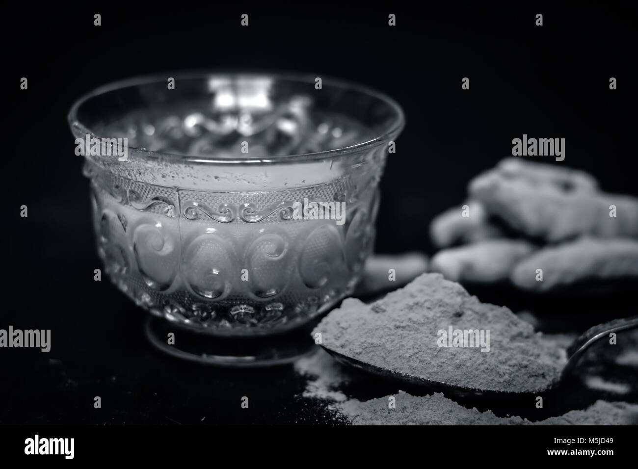 Tea of turmeric,Curcuma longa with its powder Stock Photo - Alamy