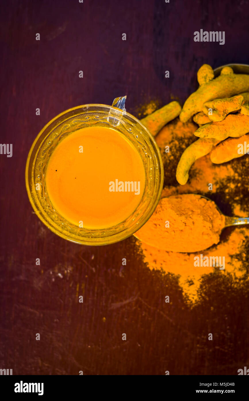 Tea of turmeric,Curcuma longa with its powder Stock Photo - Alamy