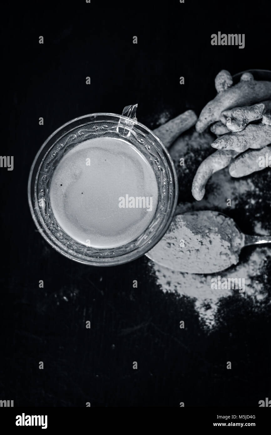 Tea of turmeric,Curcuma longa with its powder Stock Photo - Alamy