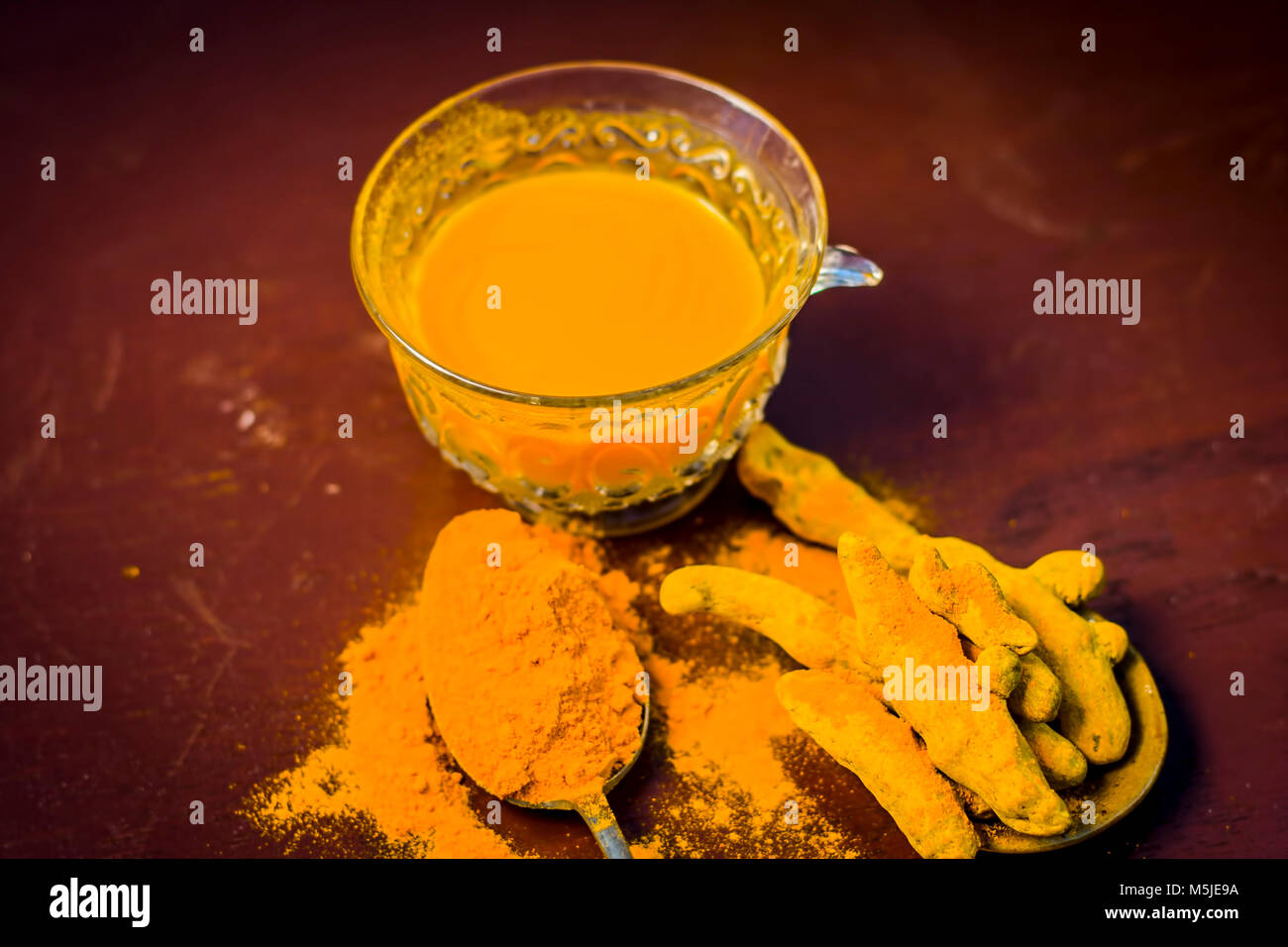 Tea of turmeric,Curcuma longa with its powder Stock Photo - Alamy