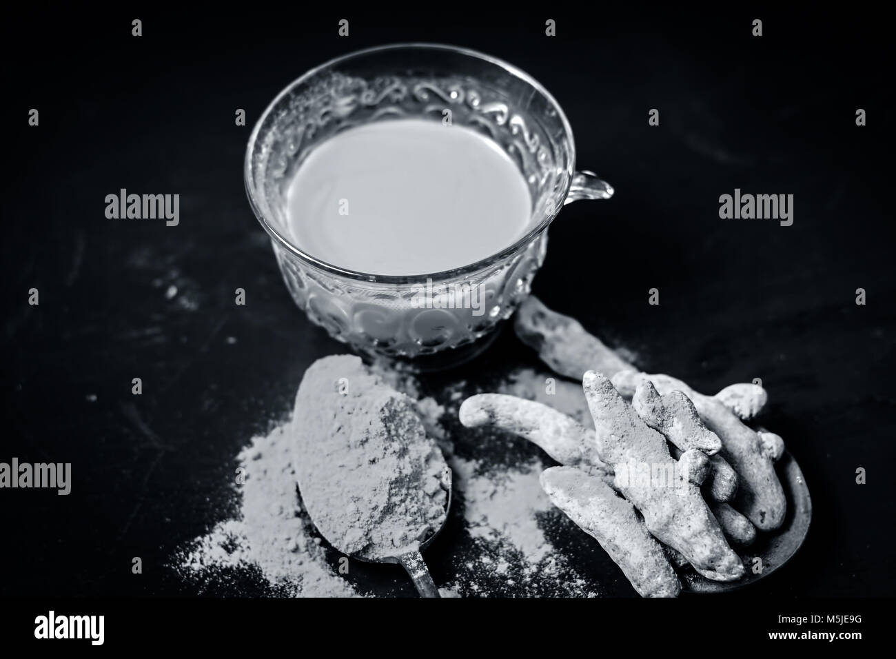 Tea of turmeric,Curcuma longa with its powder Stock Photo - Alamy