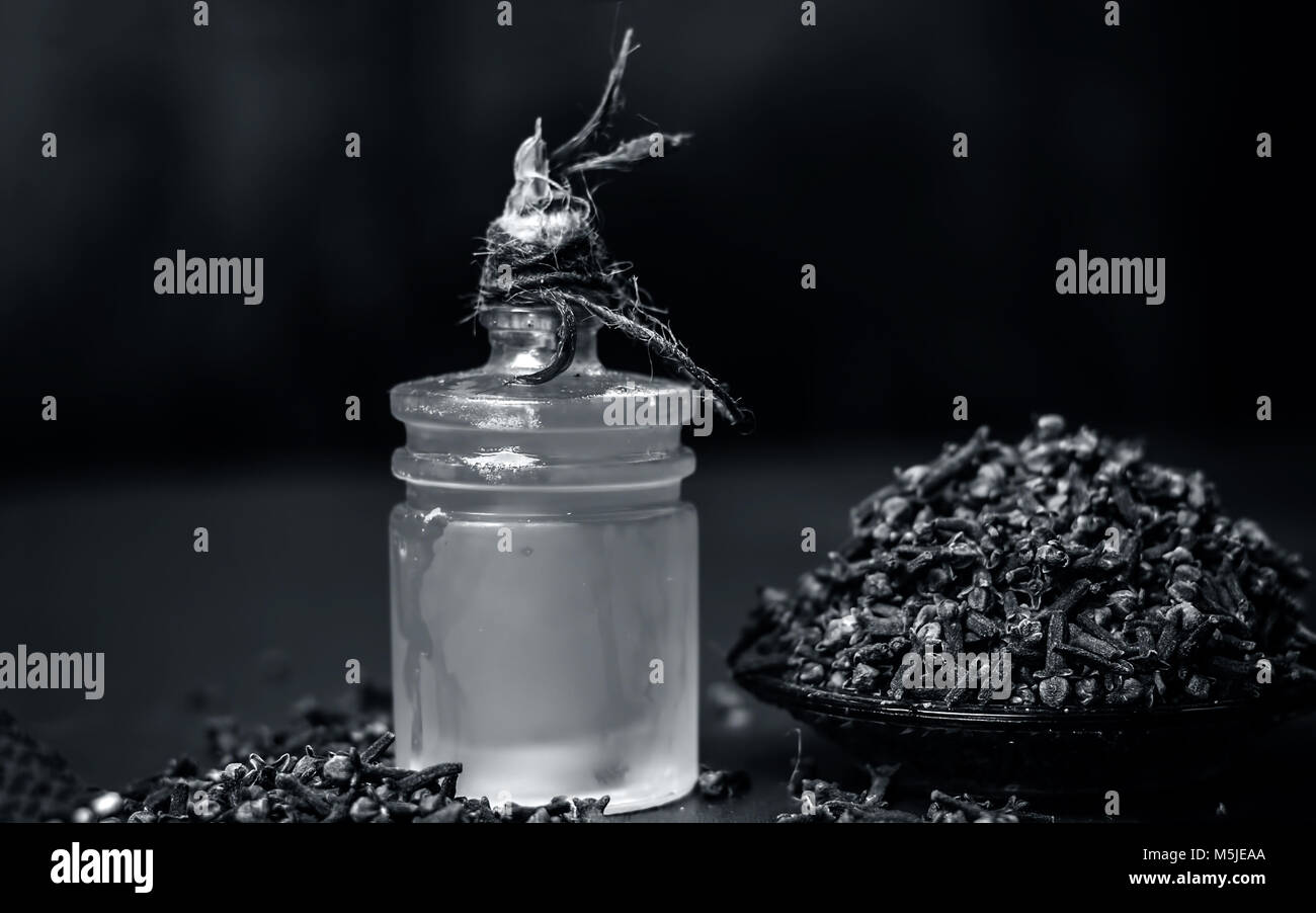 Clove,Syzygium aromaticum,laung and its oil on a wooden surface Stock ...