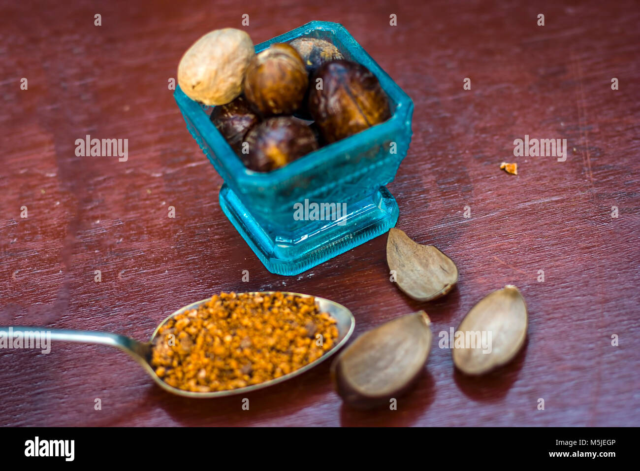 Close up of Nutmeg,Jaiphal,Myristica fragrans in a glass container with ...