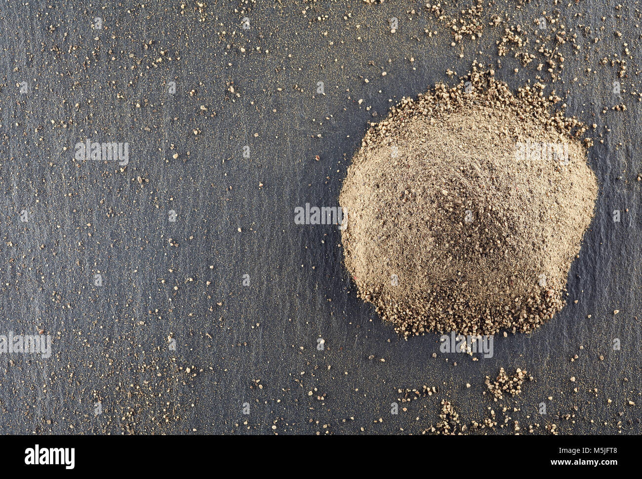 Different types of pepper. Mix of grind black pepper and allspice seeds ...