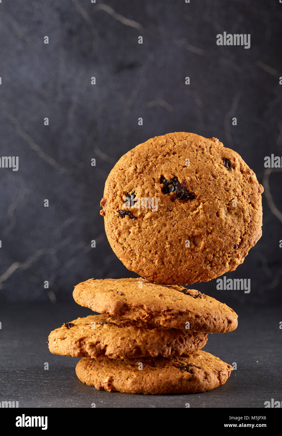 Close-up picture of chocolate cookies on dark background, shallow depth ...