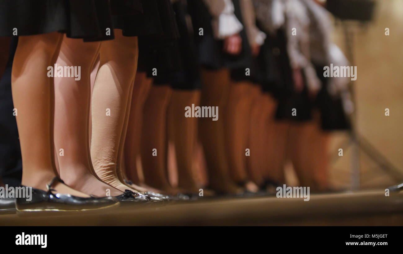 legs in pantyhose of girl - children choir - rehearsal of Academic Song ...