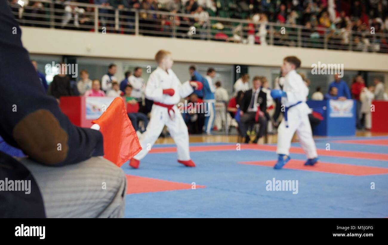 Martial art competitions- karate - judge coaches looking at female ...