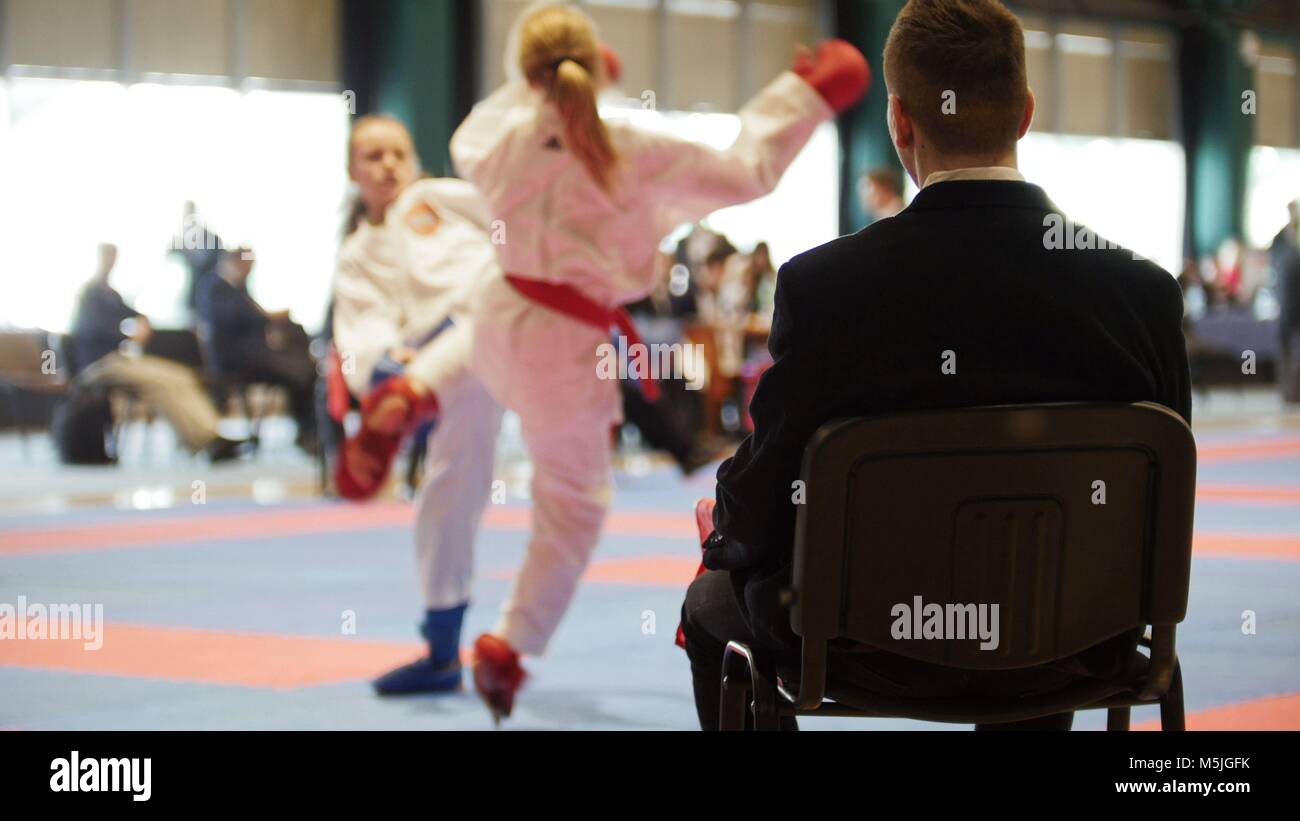 Martial art competitions - coach-judge at karate teenager's fighting ...