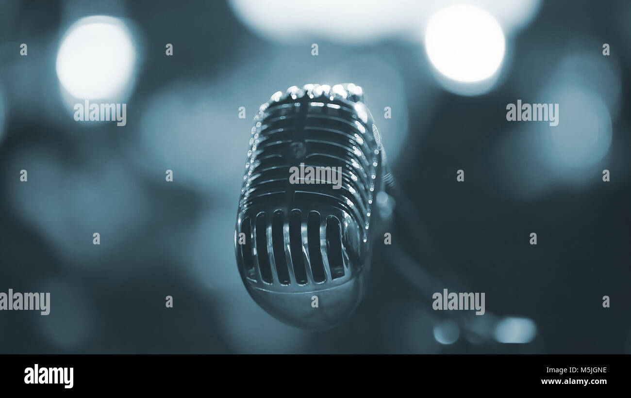 Vocal microphone at concert scene - blue toned Stock Photo - Alamy