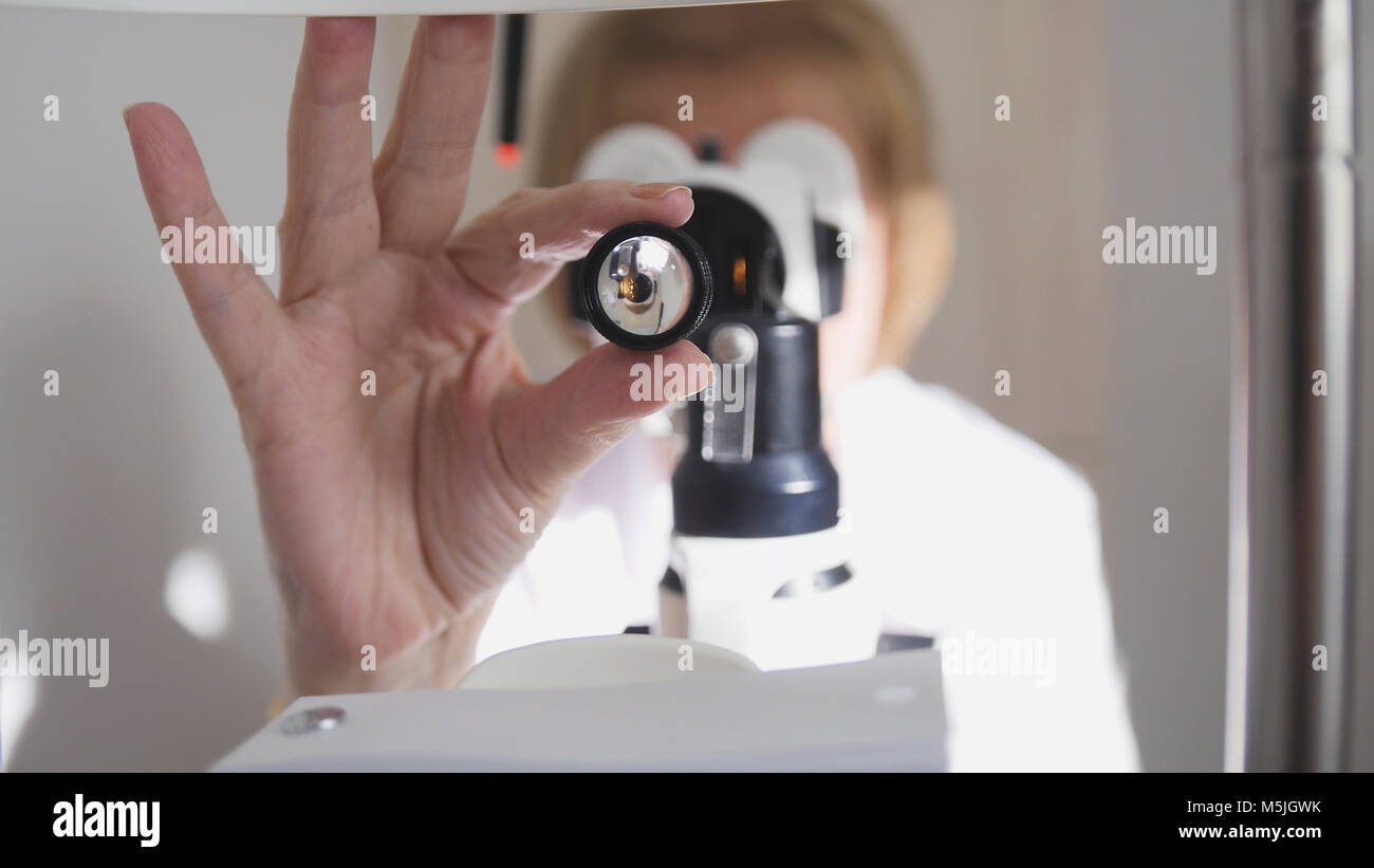 Optometrist examining patients eyes eye hi-res stock photography and ...
