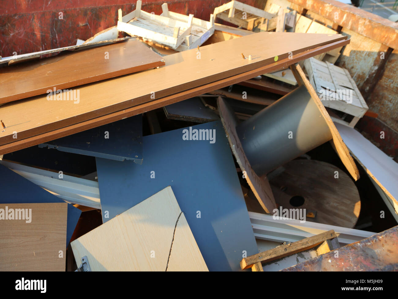 various pieces of wood in a rusty container Stock Photo - Alamy