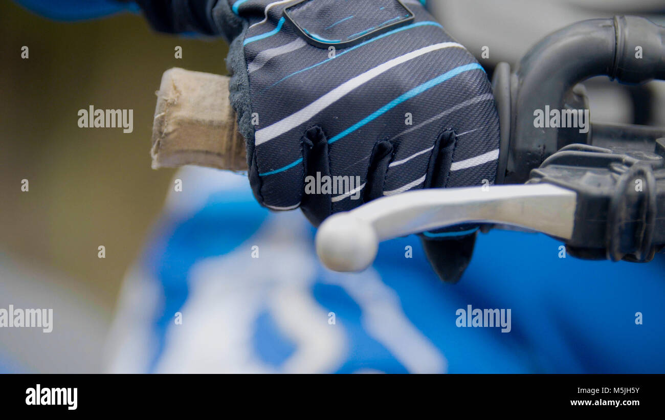 Cross motorcycle engine start - hand on handlebar Stock Photo - Alamy