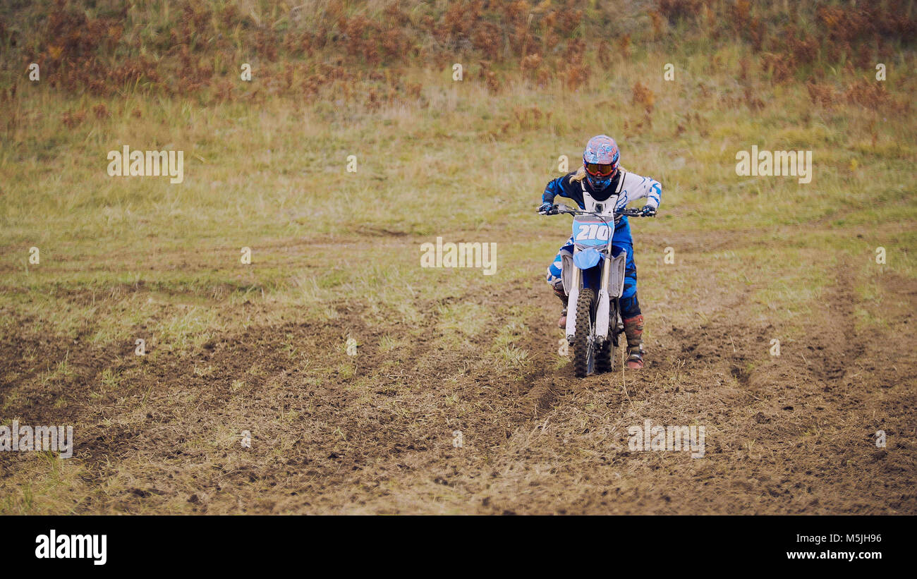 Crazy girl mx biker - motocross racer on dirt bike at sport track Stock ...