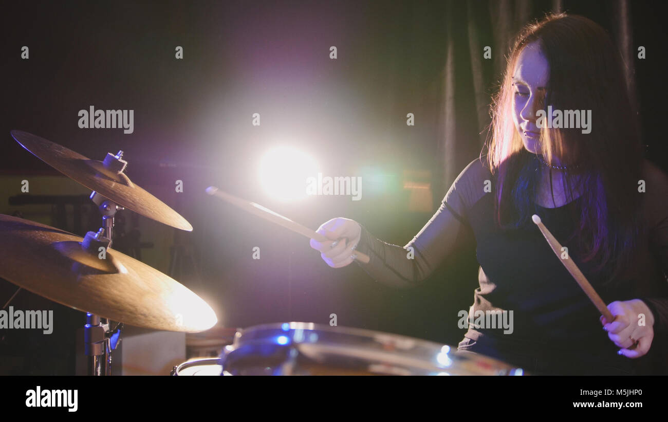 Young woman percussion drummer performing with drums Stock Photo - Alamy