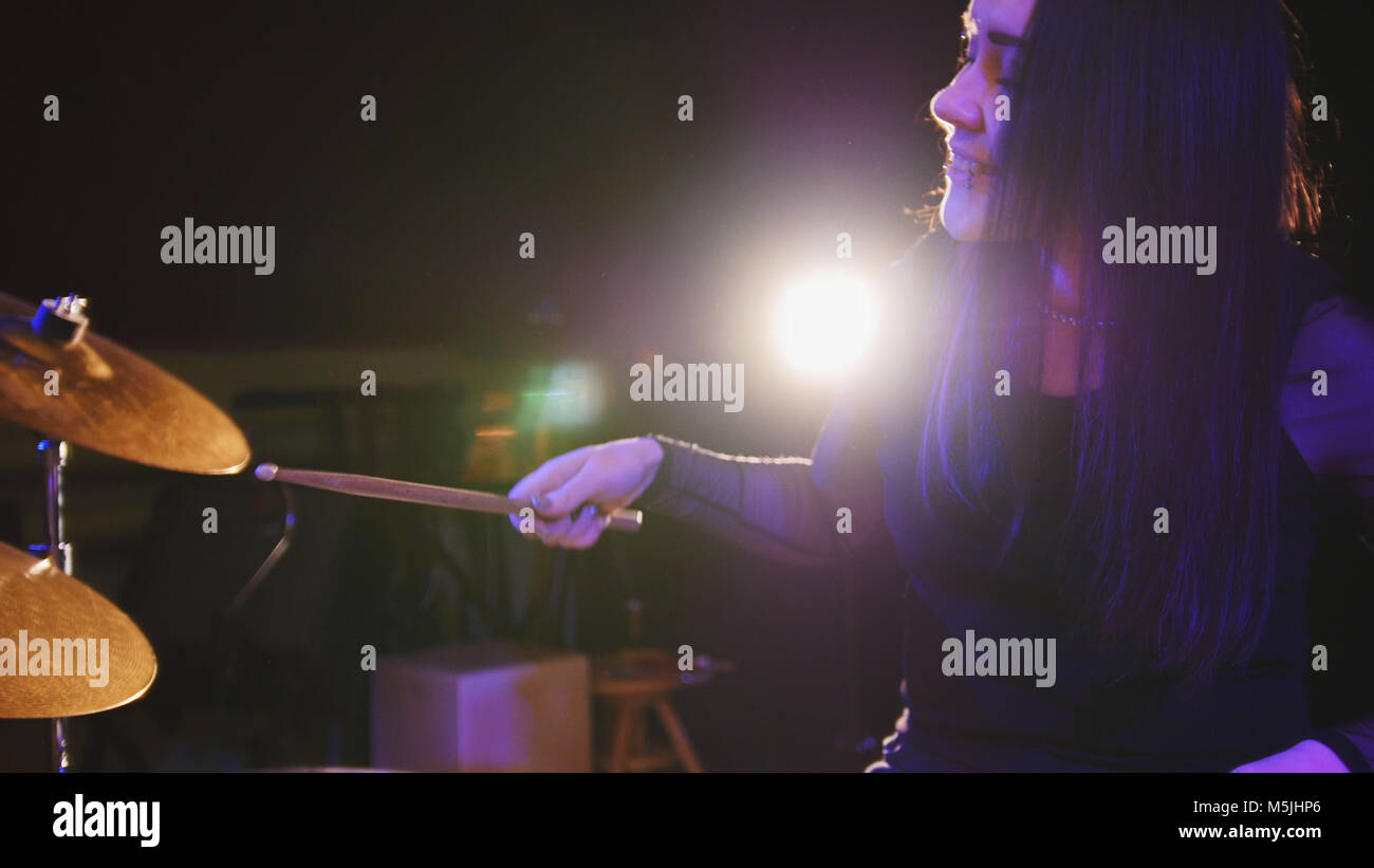 Girl rock musician - female drummer performing Stock Photo - Alamy