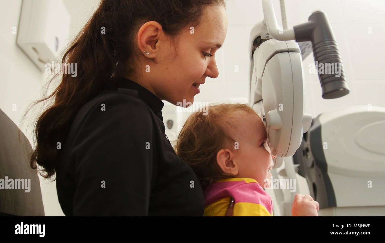 Children ophthalmology - mother and cute little girl - optometrist ...