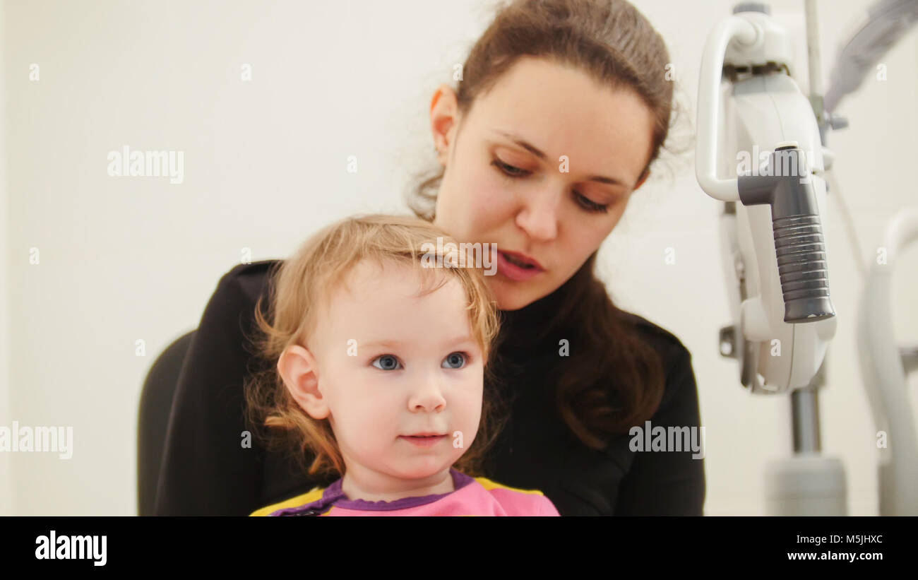 Children ophthalmology - mother and cute little girl - optometrist ...