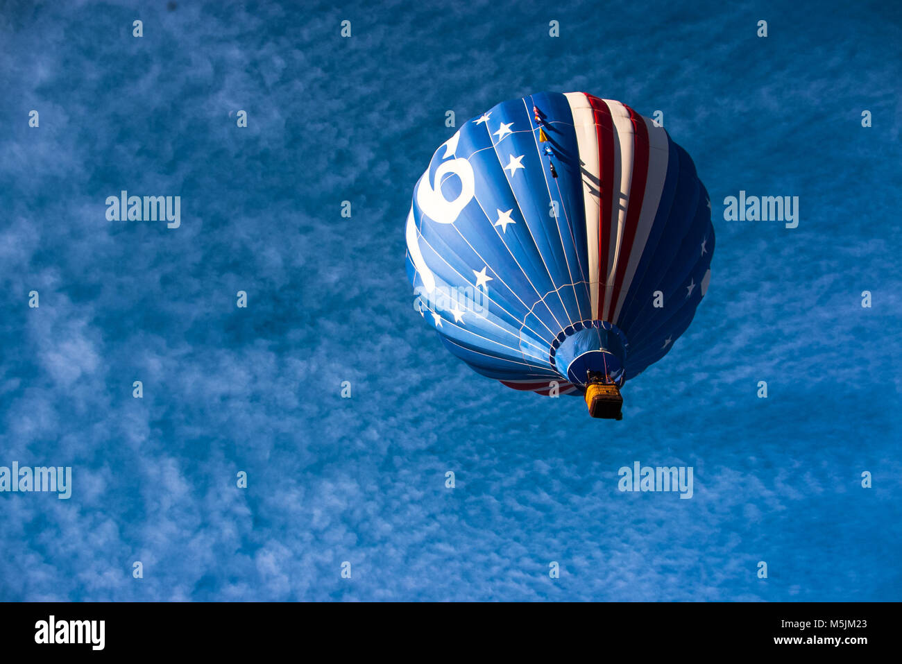 Early morning, hot air balloons fly over Colorado Springs, Colorado for ...