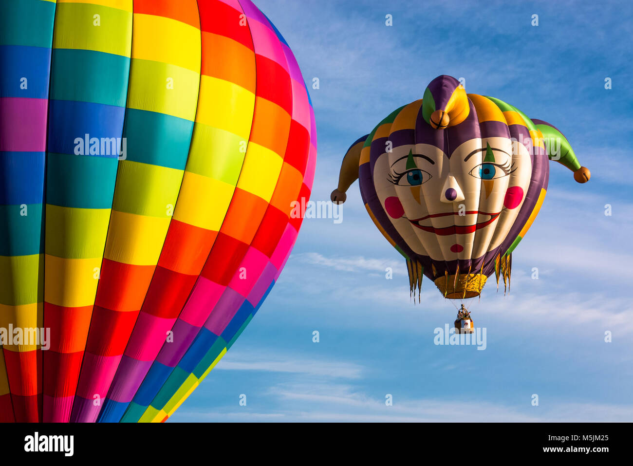 Early morning, hot air balloons fly over Colorado Springs, Colorado for ...