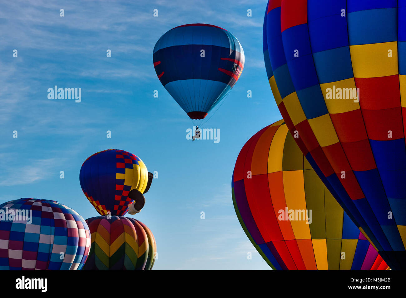 Early morning, hot air balloons fly over Colorado Springs, Colorado for ...