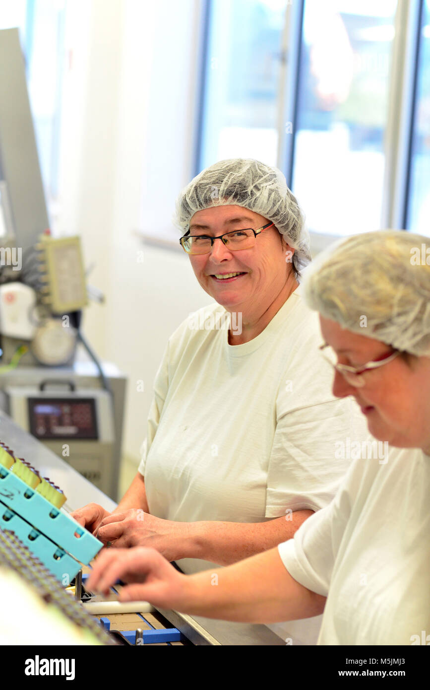 Food factory line people hi-res stock photography and images - Alamy