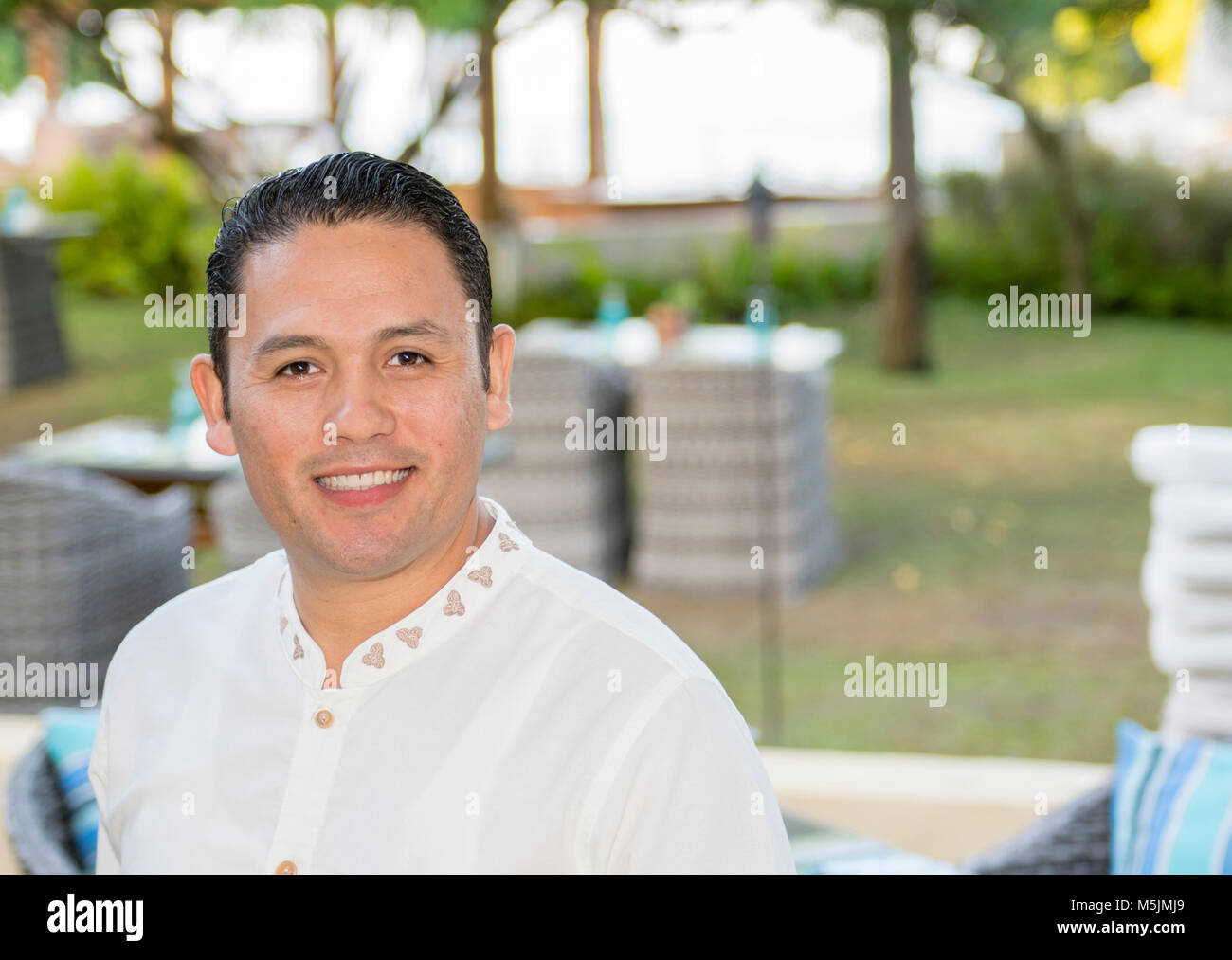Friendly, Smiling, Young Mexican Man Working as a Server at a Resort ...