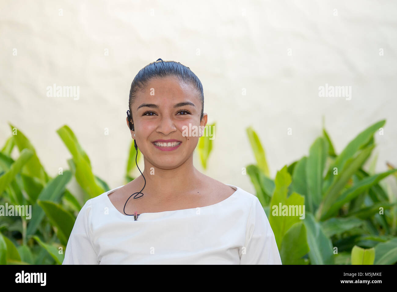 Smiling Beautiful Young Mexican Woman Working as a Hostess at a Resort ...
