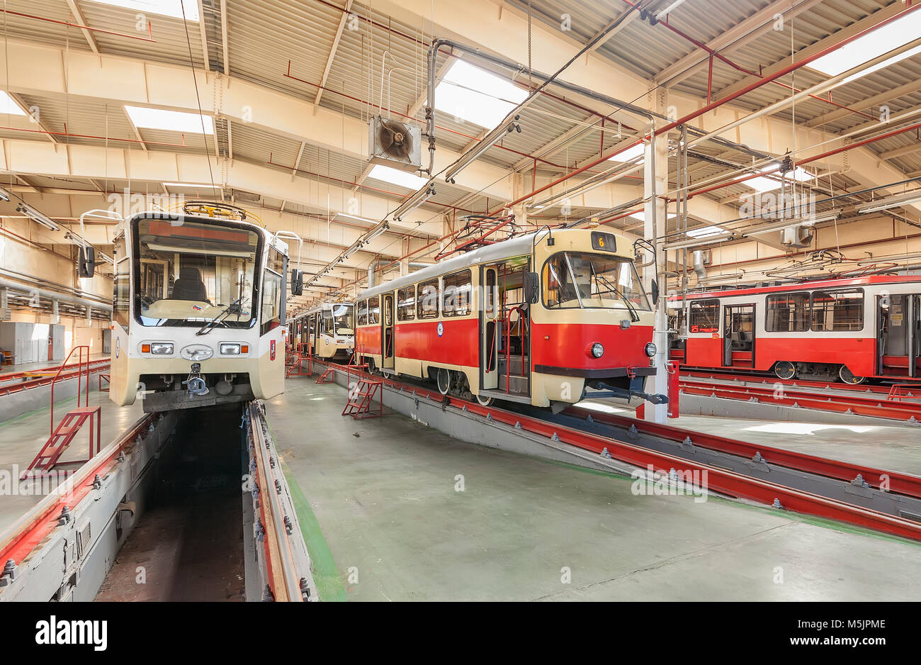 Trams at regular maintenance inside the tram depot Stock Photo - Alamy