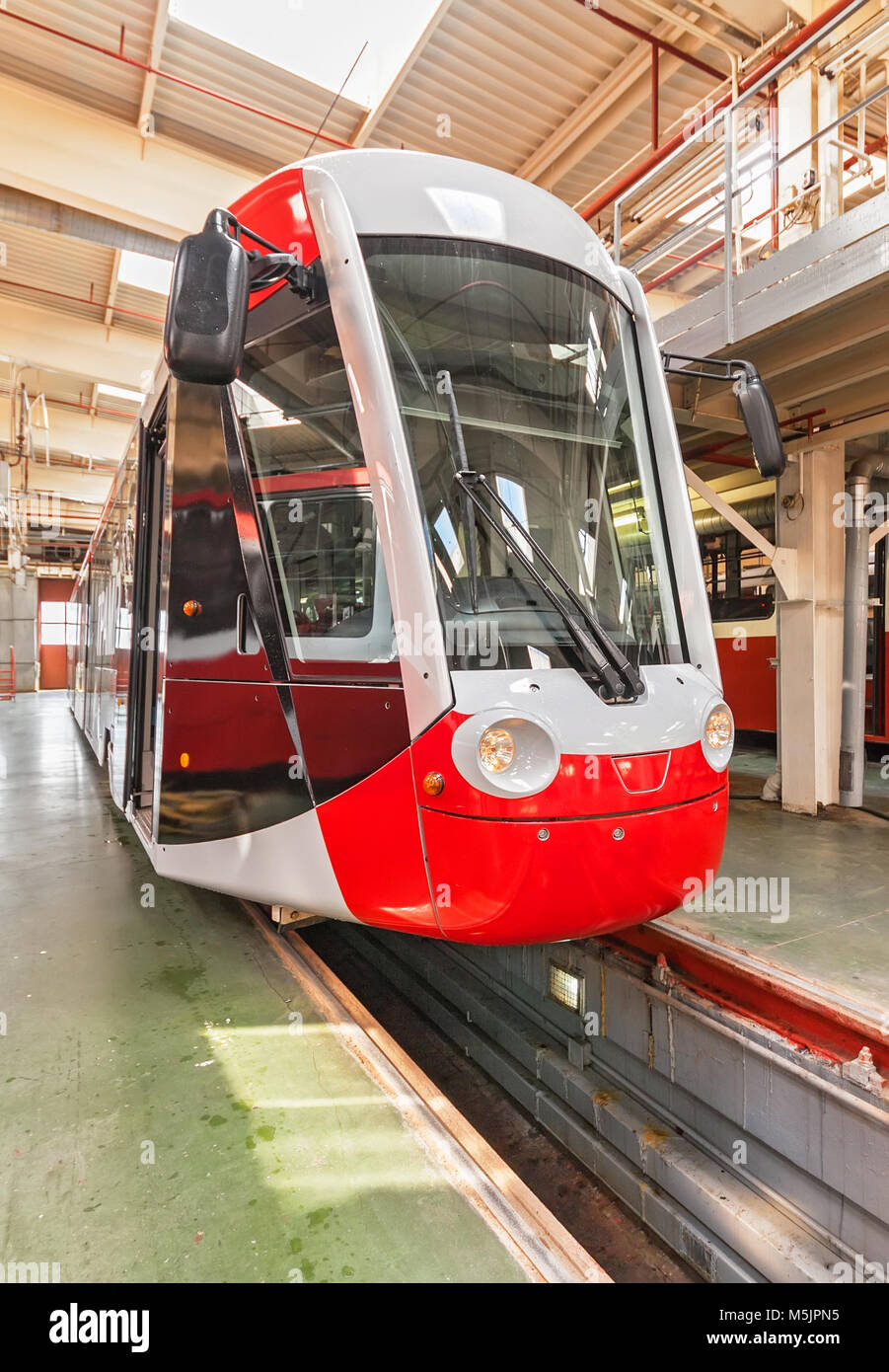 Red modern city tram Stock Photo - Alamy
