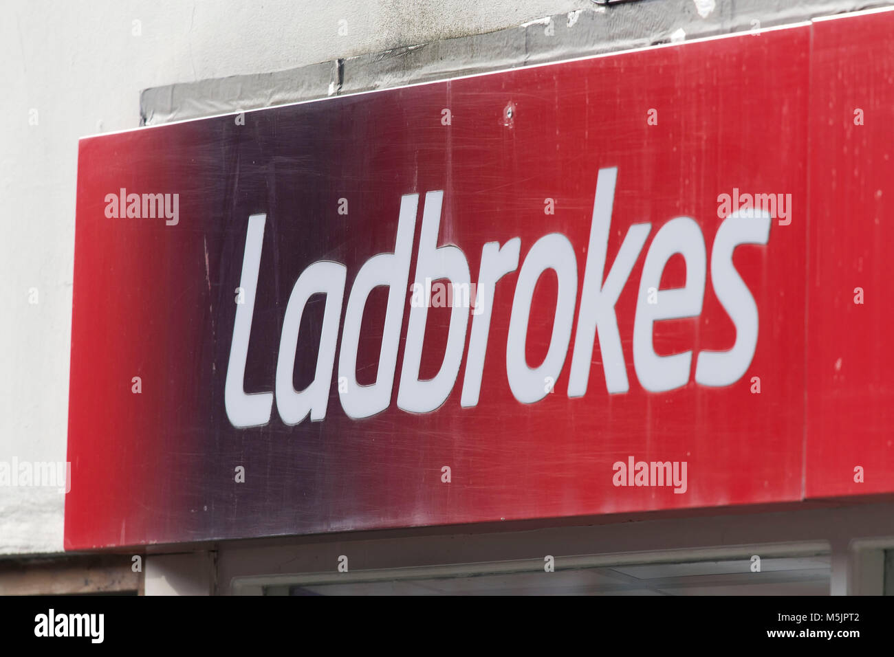 ladbrokes bookies betting shop store sign logo Stock Photo - Alamy