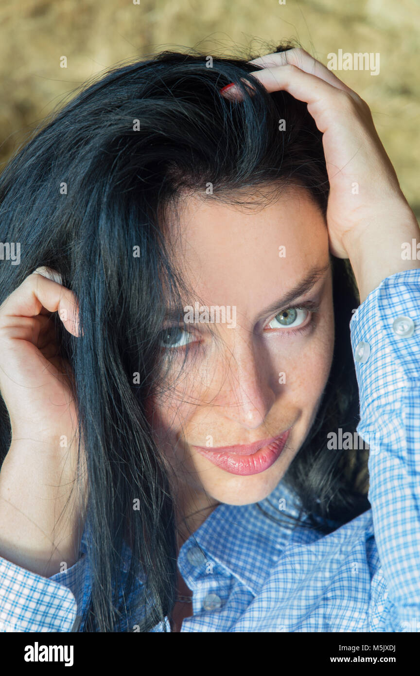 Close up on female face with seductive smile and look Stock Photo - Alamy