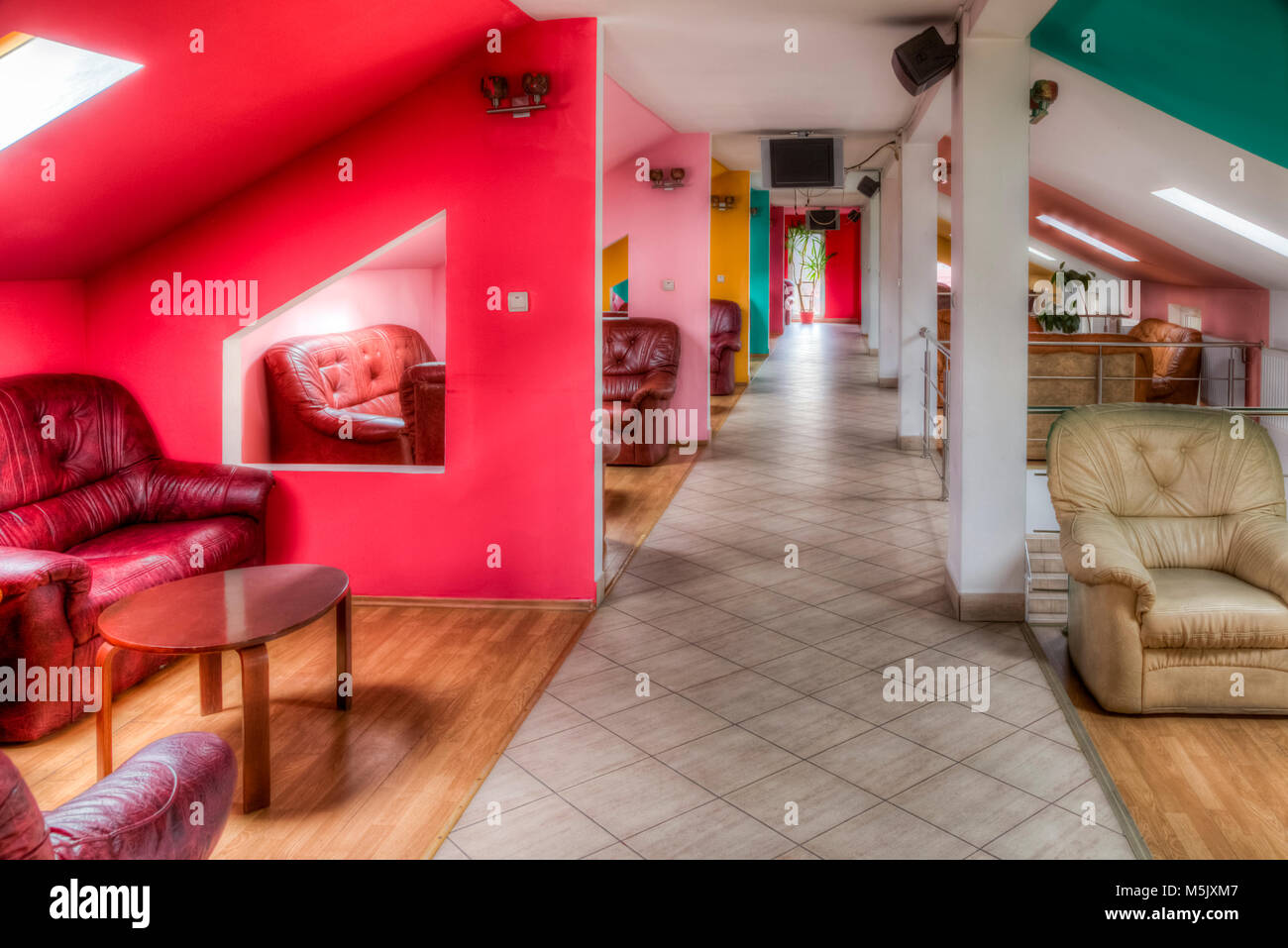 Image of a hotel lounge with a corridor and armchairs Stock Photo - Alamy