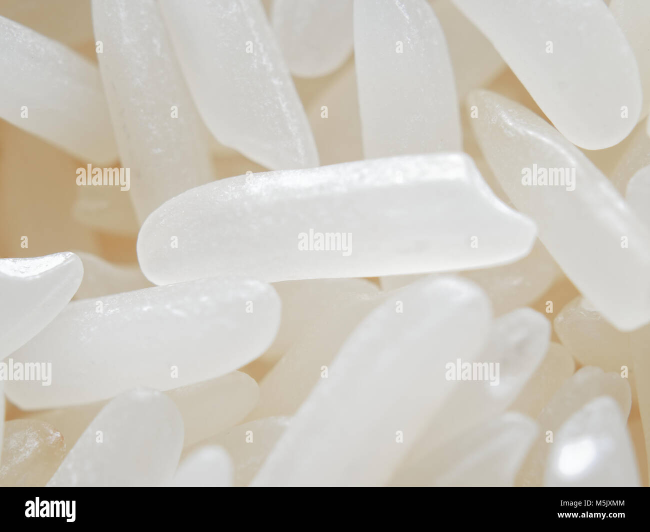 White raw rice in close up with texture Stock Photo - Alamy