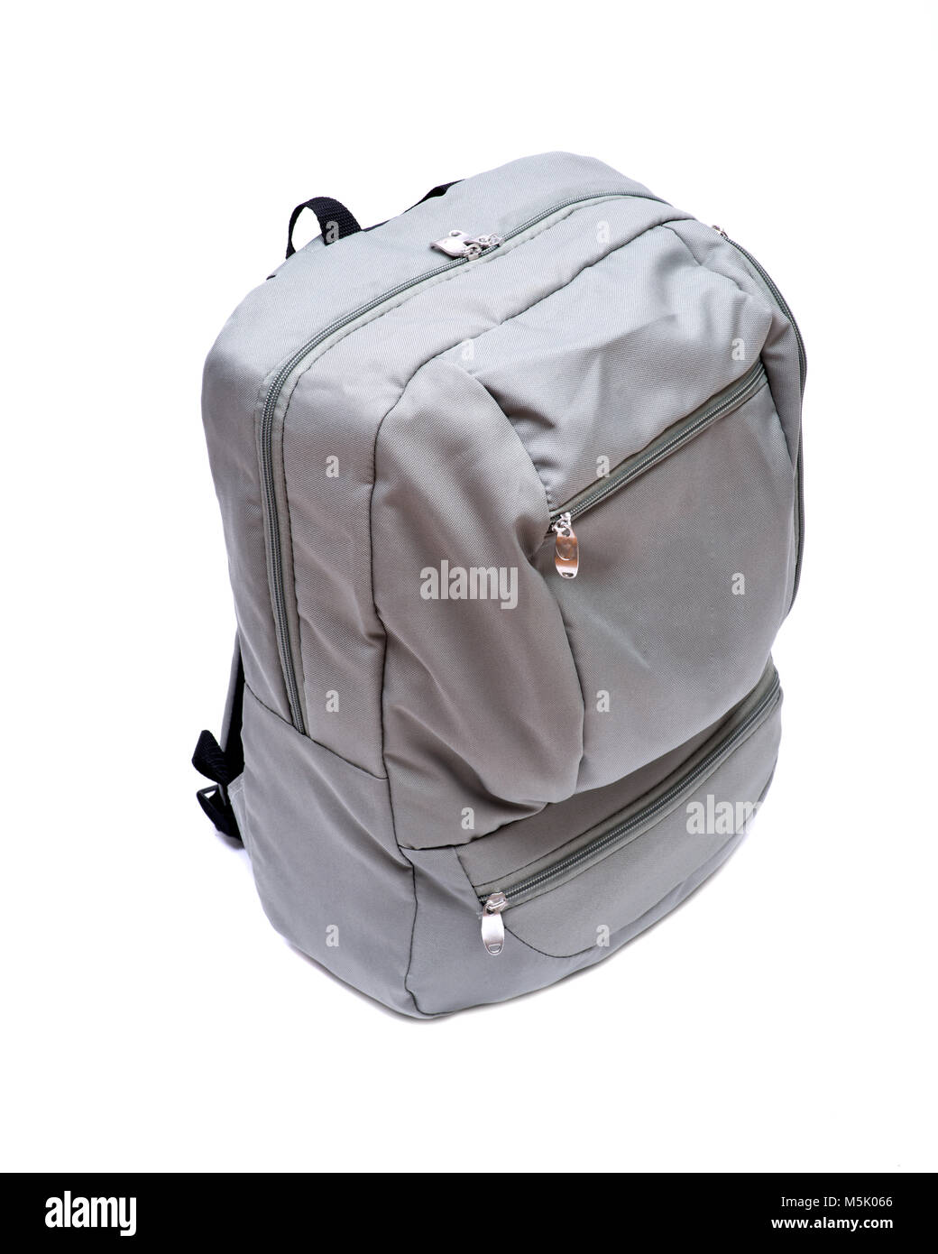 Grey water resistant nylon backpack isolated on white background Stock ...