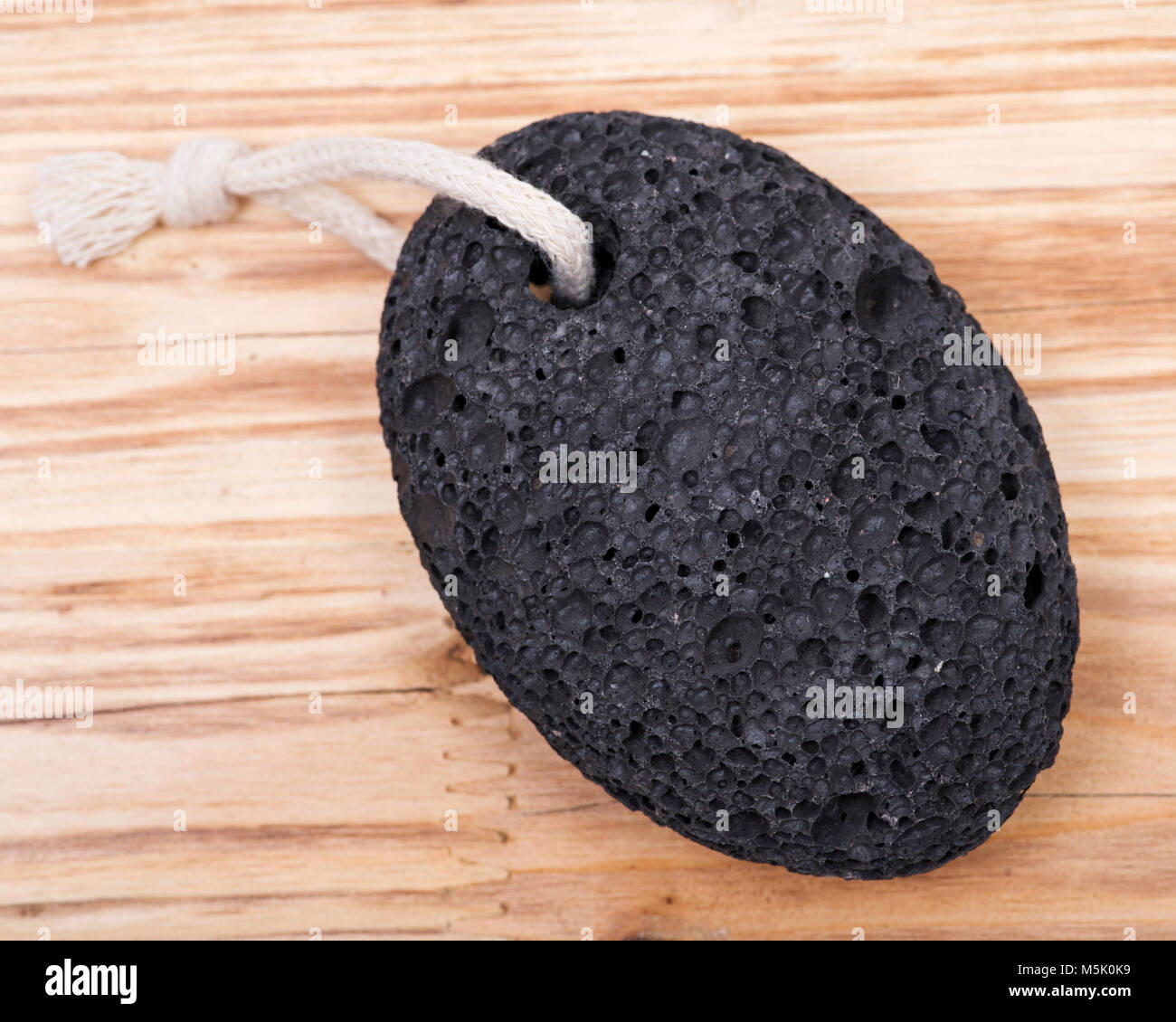 Real volcanic pumice stone on wooden vintage background Stock Photo - Alamy
