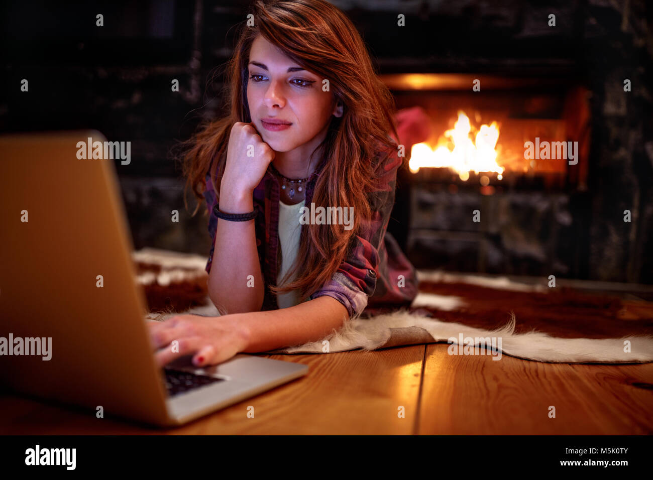 Young girl with laptop computer browsing on the Internet Stock Photo ...