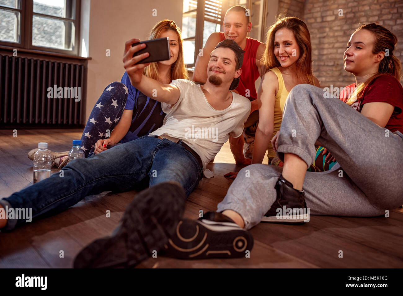 dancing, sport and urban culture concept - Group of smiling dancers ...