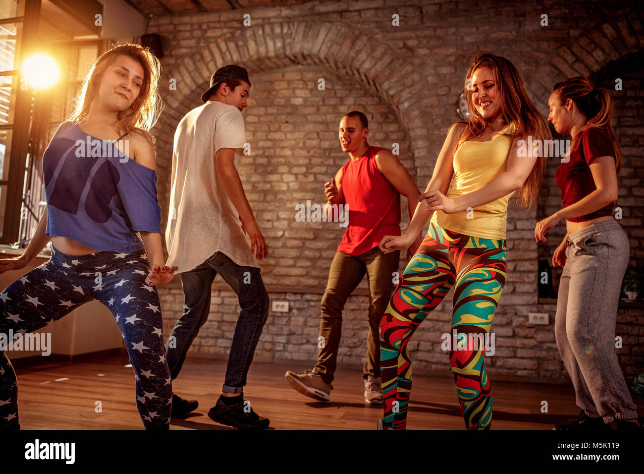 Group of young modern dancers dancing in the studio. Sport, dancing and ...